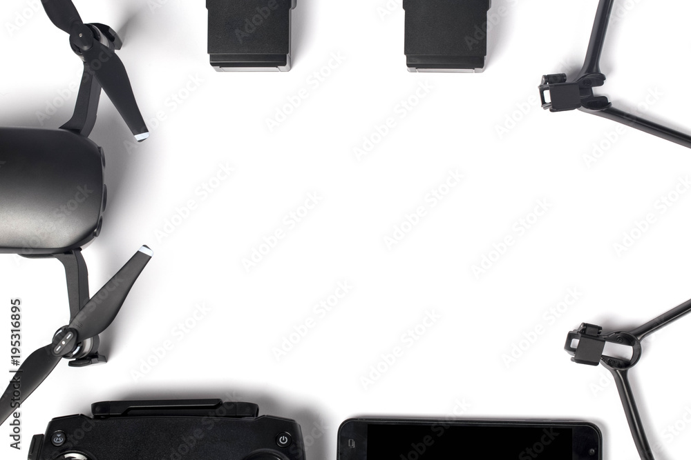 drone and its accessories are put in the shape of a frame on a white ...
