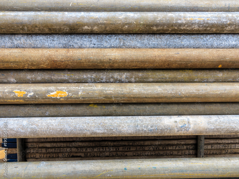 Mental scaffold pipe stack together on scaffold plank wood shelve with ...