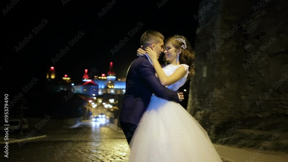 A beautiful castle on a hill. Fortified palace on the rocks at night ...