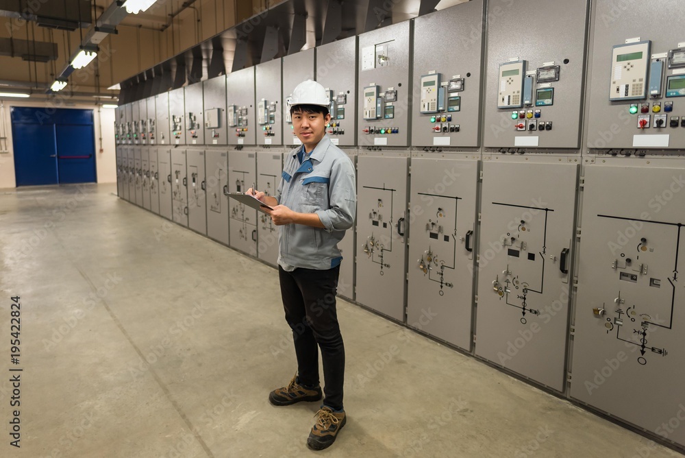 Engineer working and check status switchgear electrical energy ...