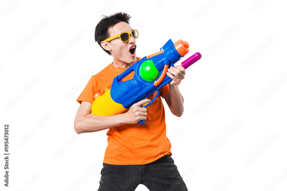 Young man holding water gun on white background. Stock Photo | Adobe Stock