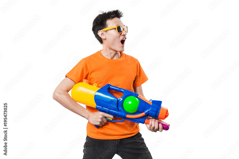 Young man holding water gun on white background. Stock Photo | Adobe Stock