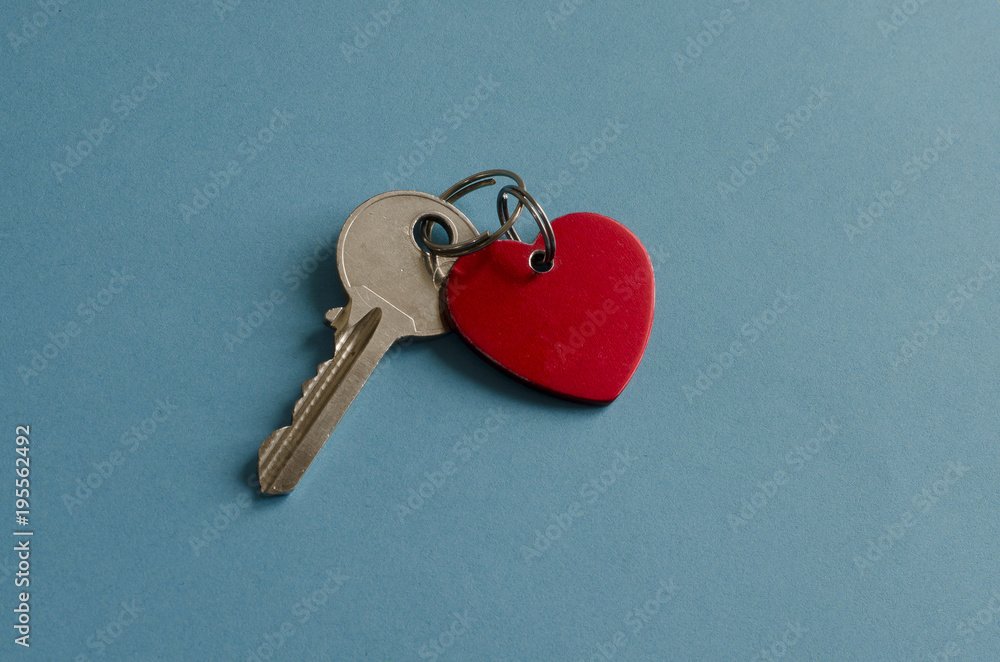 Red heart key chain. Key. Blue background Stock Photo | Adobe Stock