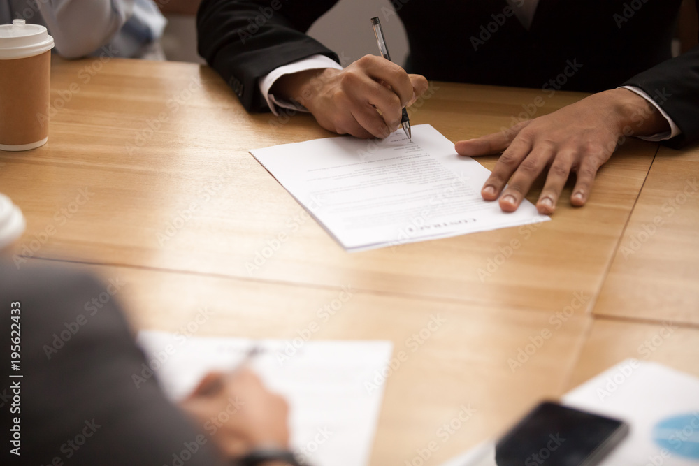 Businessman in suit signing business contract at meeting, entrepreneur ...