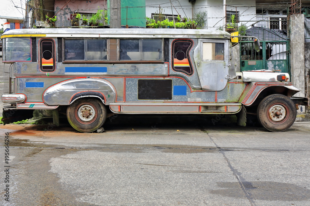 Filipino grey-silvery dyipni-jeepney car stationed in Baguio town ...