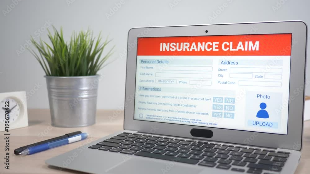Online insurance claim form showing on a laptop computer screen sitting ...