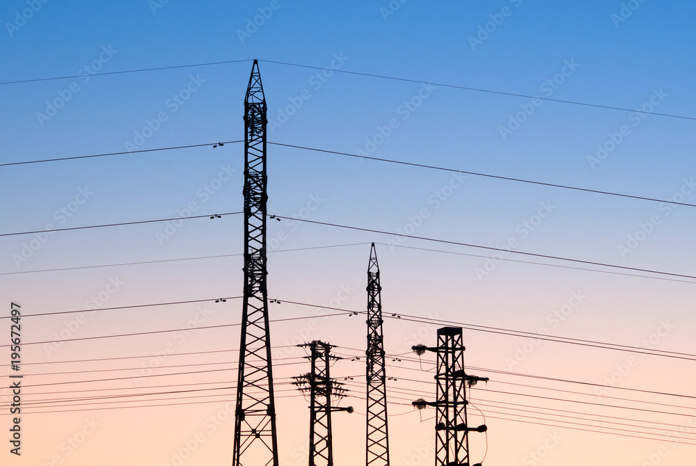 Power poles and power lines at sunset Stock Photo | Adobe Stock
