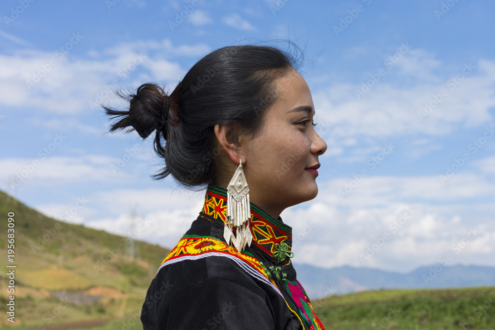 Beautiful Chinese Yi people in traditional costumes outdoor Stock Photo ...