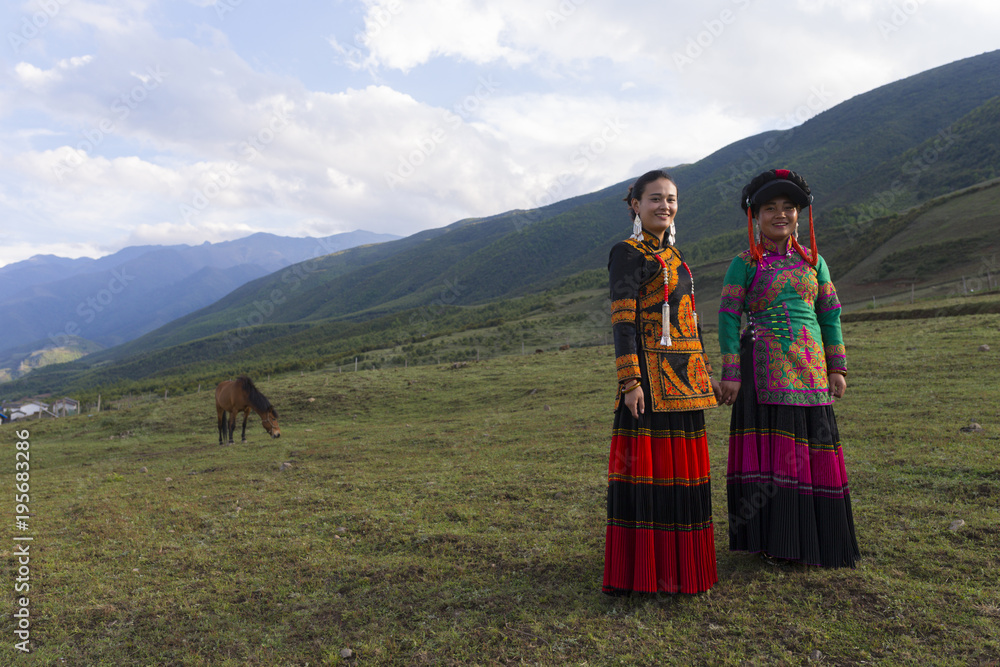 Beautiful Chinese Yi people in traditional costumes outdoor Stock Photo ...
