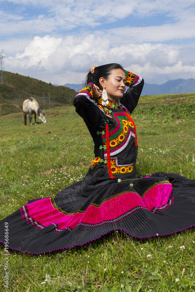 Beautiful Chinese Yi people in traditional costumes outdoor Stock Photo ...