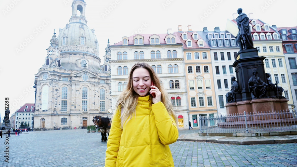 Delightful female walks around city's Dresden main quarter and talks on ...