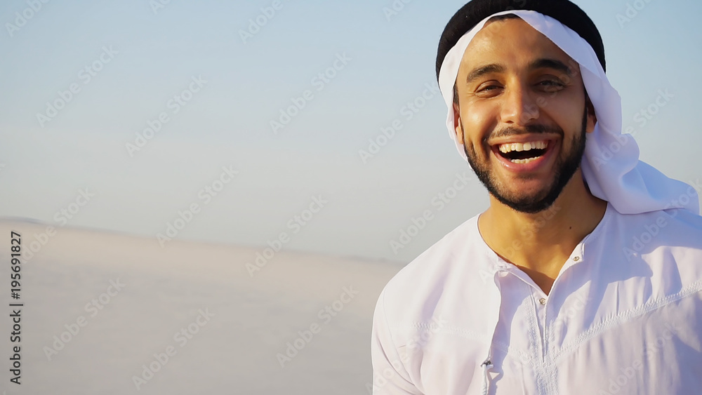 Close-up shot of portrait of Arabian Sheikh young man with beautiful ...