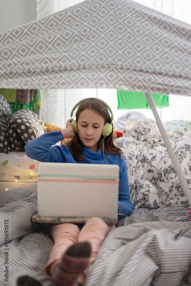 tween girl in her room, under a cubby house, listening to music Stock ...