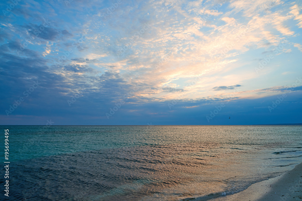 Coast of the sea at sunset. On the shore of the Caspian Sea. The ...