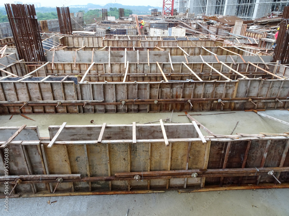 Construction workers fabricated timber form work at the construction ...