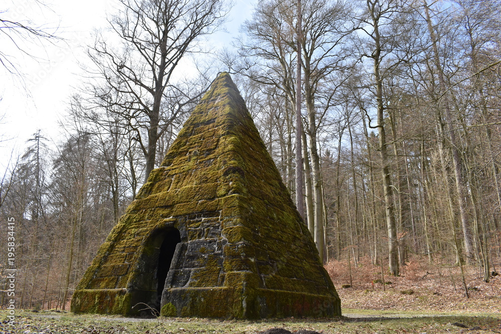 Ancient stone pyramid with moss in the forest on the way to the World ...