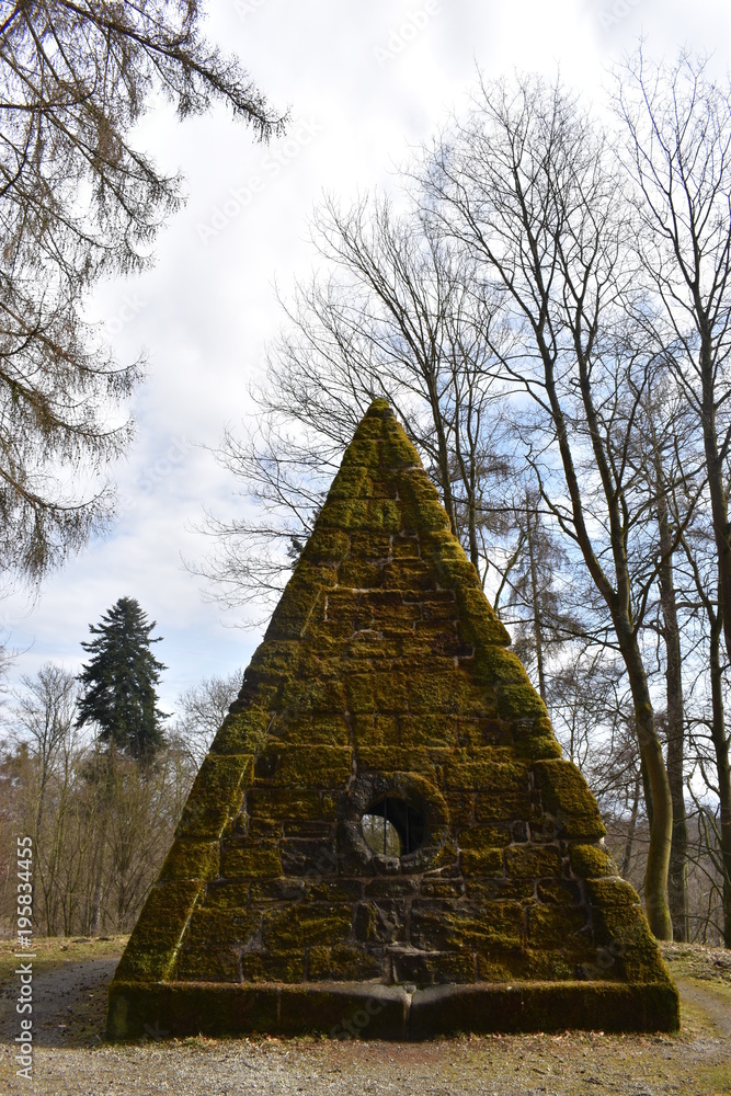 Ancient stone pyramid with moss in the forest on the way to the World ...