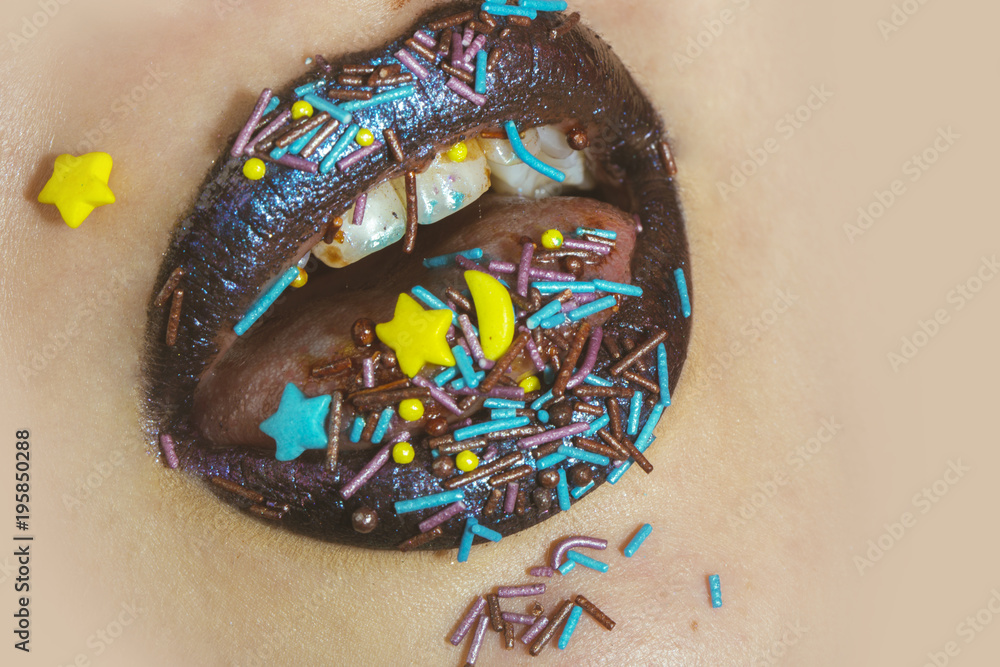 Brown lips in sweets star. Colorful sprinkles on lips, teeth and in ...