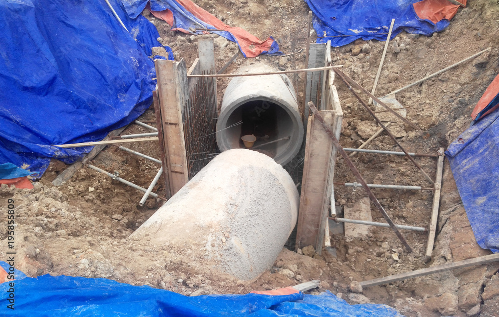 Precast concrete round culvert drain under construction at the ...