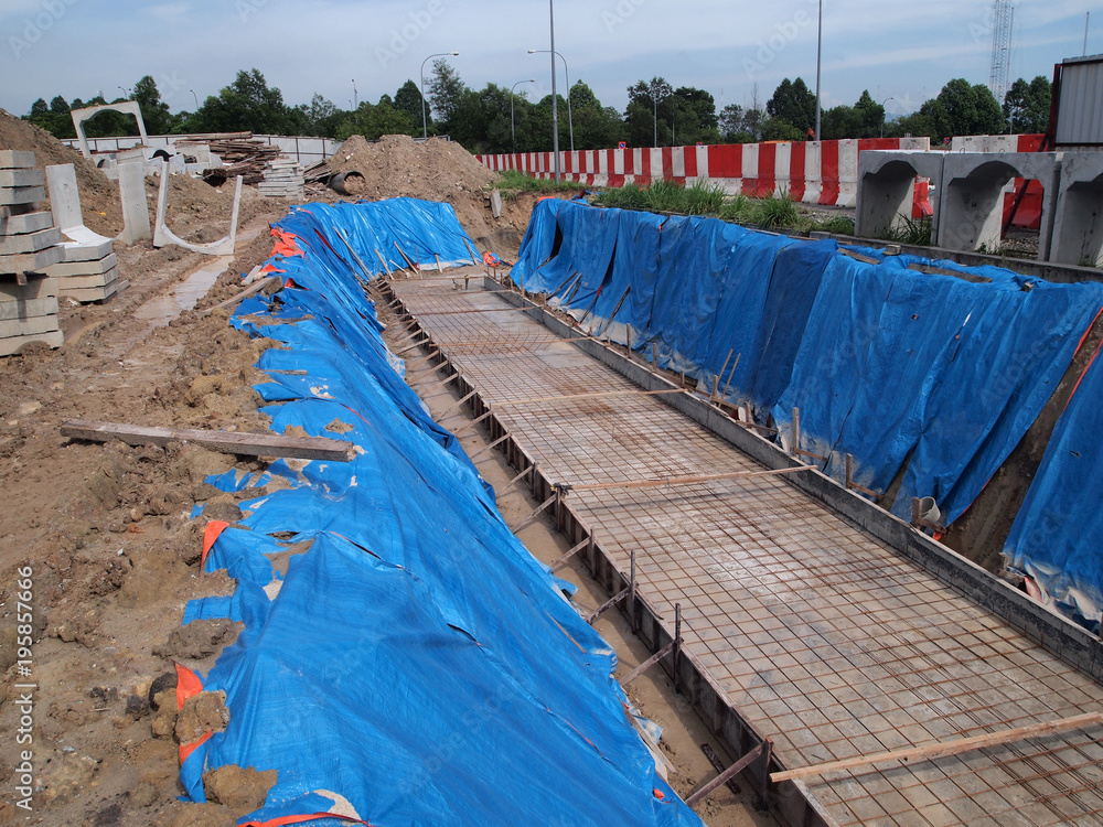 Underground utilities trenches under construction. Construction workers ...