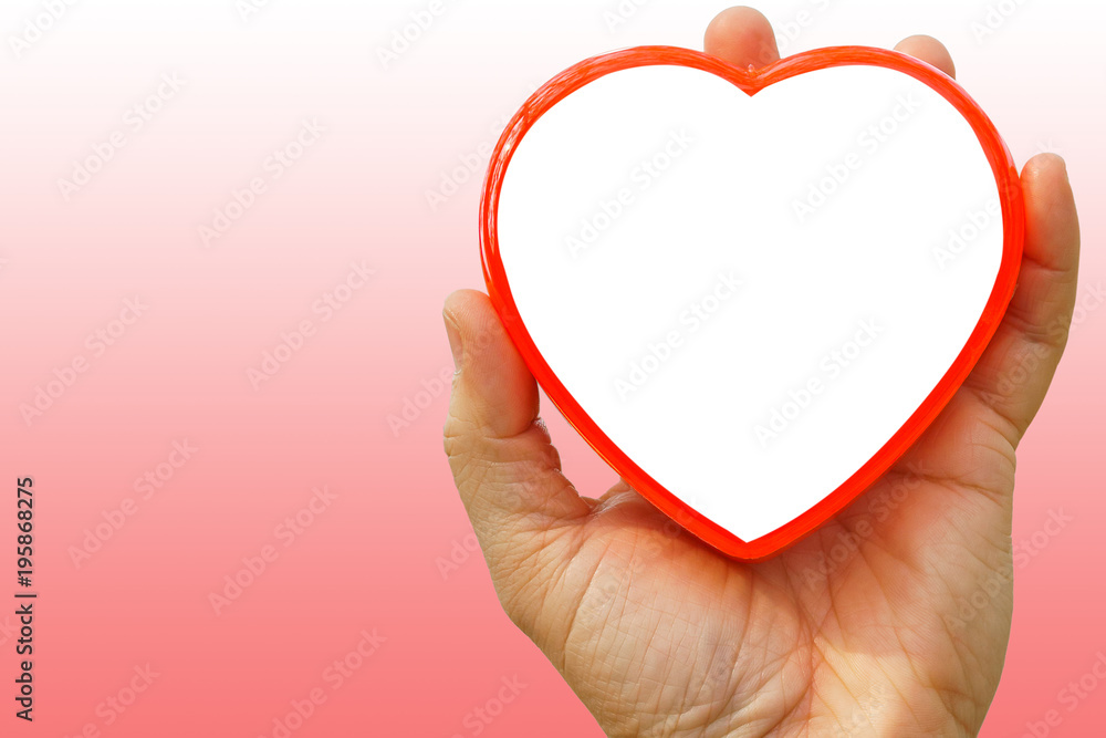 Heart frame on hand with a pink gardient background. Stock Photo ...