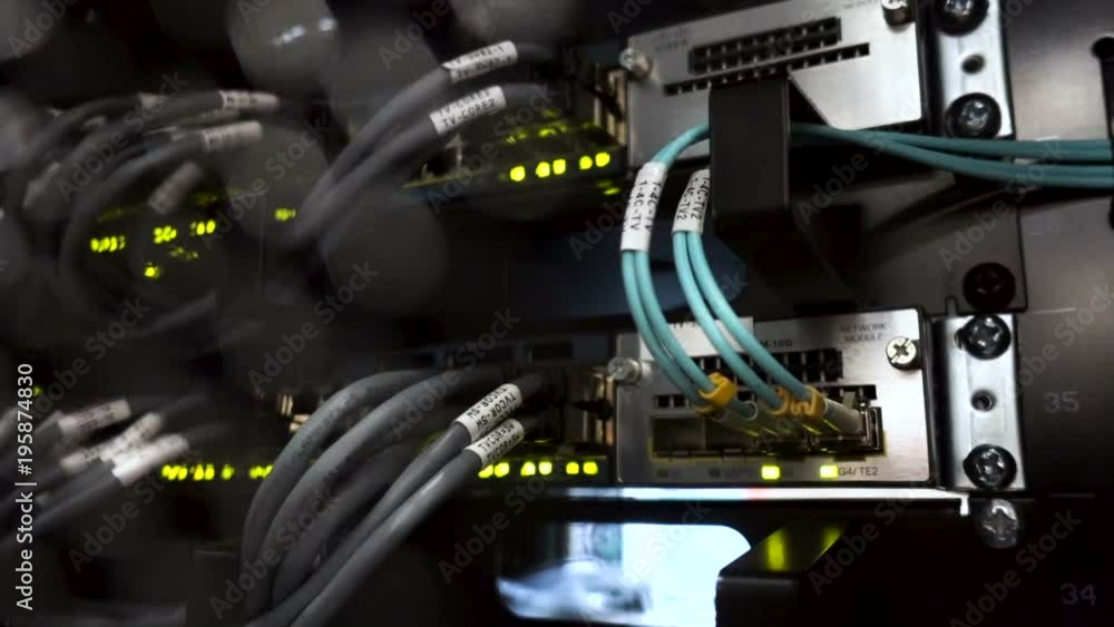 Working Ethernet switch in data center room, connecting computers together. Working Ethernet ...