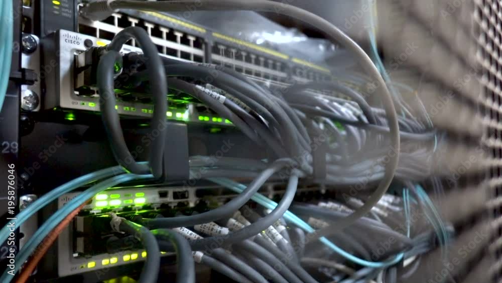 Working Ethernet switch in data center room, connecting computers together. Working Ethernet ...