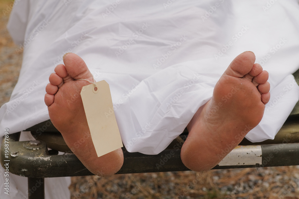 Dead mans feet with toe tag Stock Photo | Adobe Stock