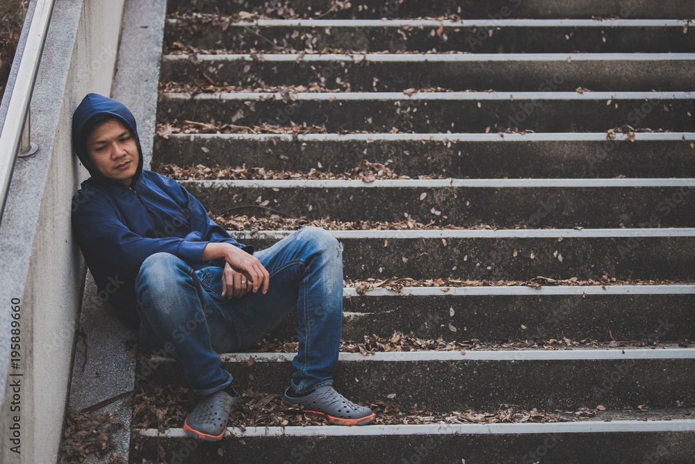 Portrait of asian man sad,drug addict man sitting on the floor,flakka ...