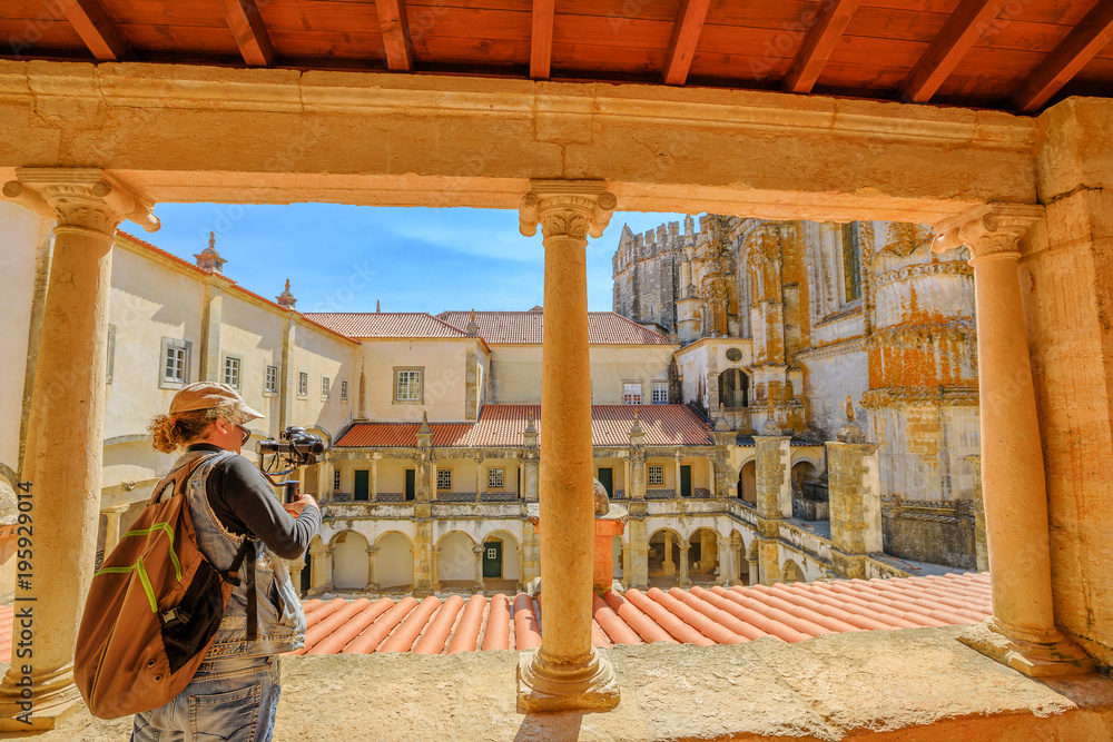 Photographer with stabilizer and professional camera takes photos at ...