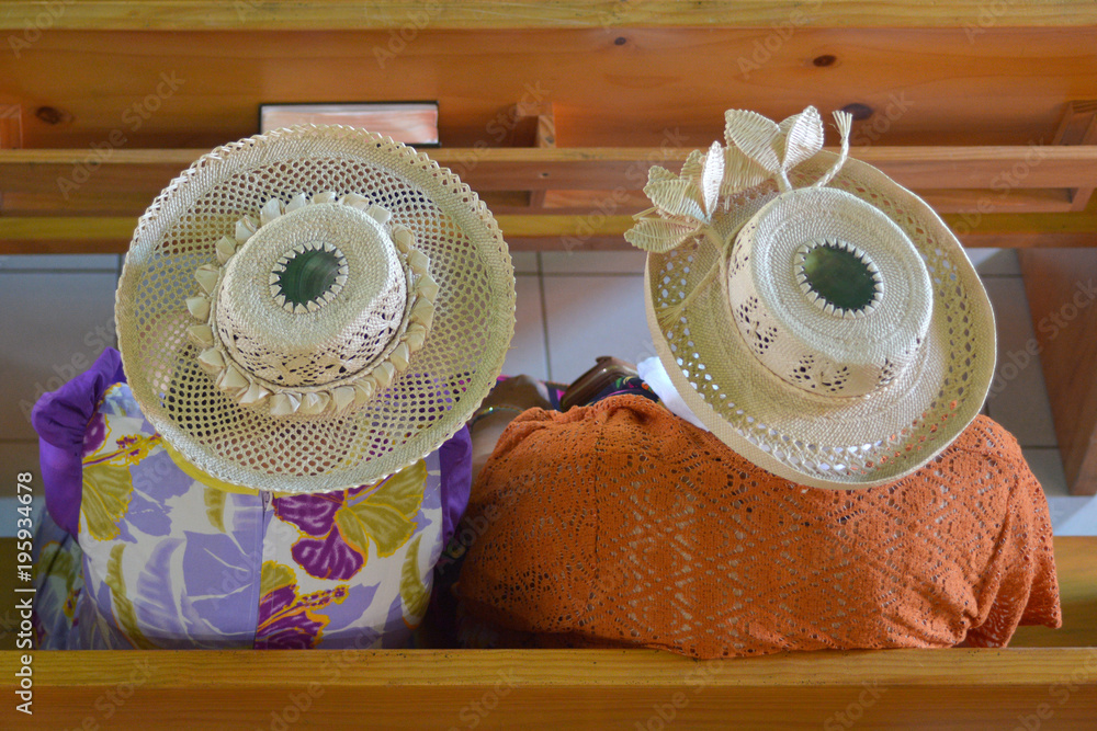 Unrecognizable Cook Islander women wearing a Rito hat at the Christian ...