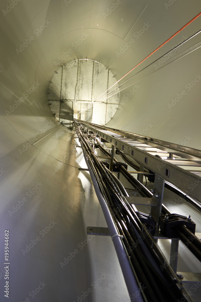 Inside the wind turbines. A wind farm is a group of wind turbines in ...