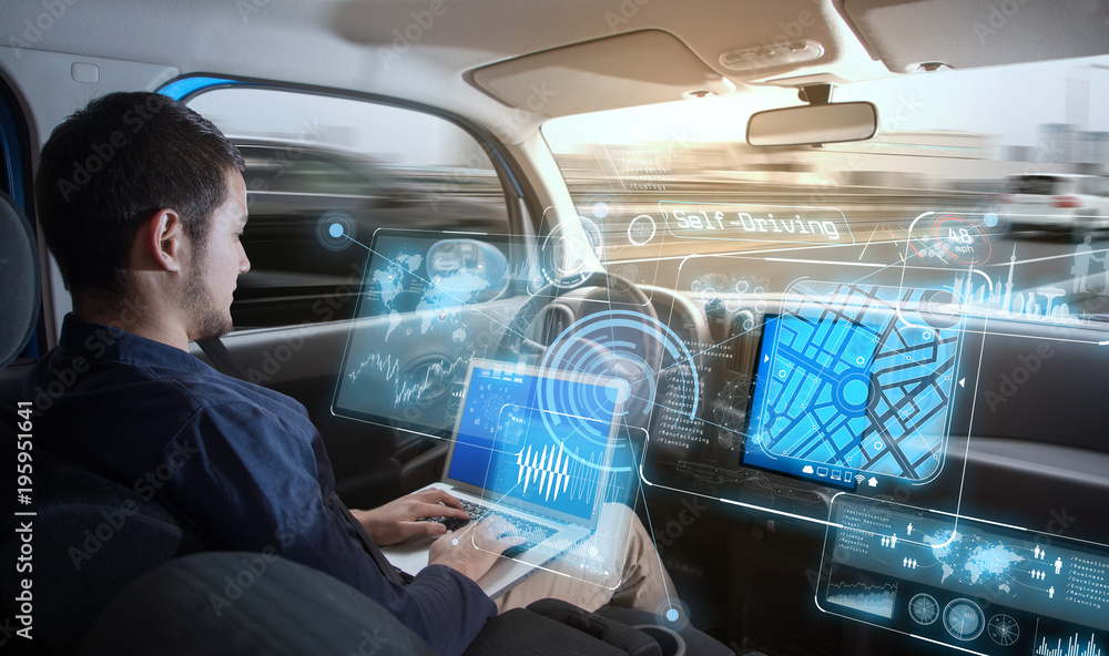 Young man riding autonomous car. Stock Photo | Adobe Stock