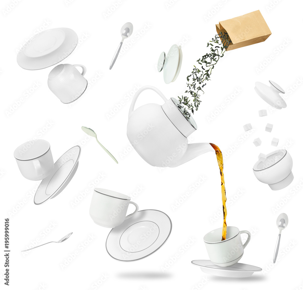 Falling tea leaves, cups, saucers and pot isolated on white background ...