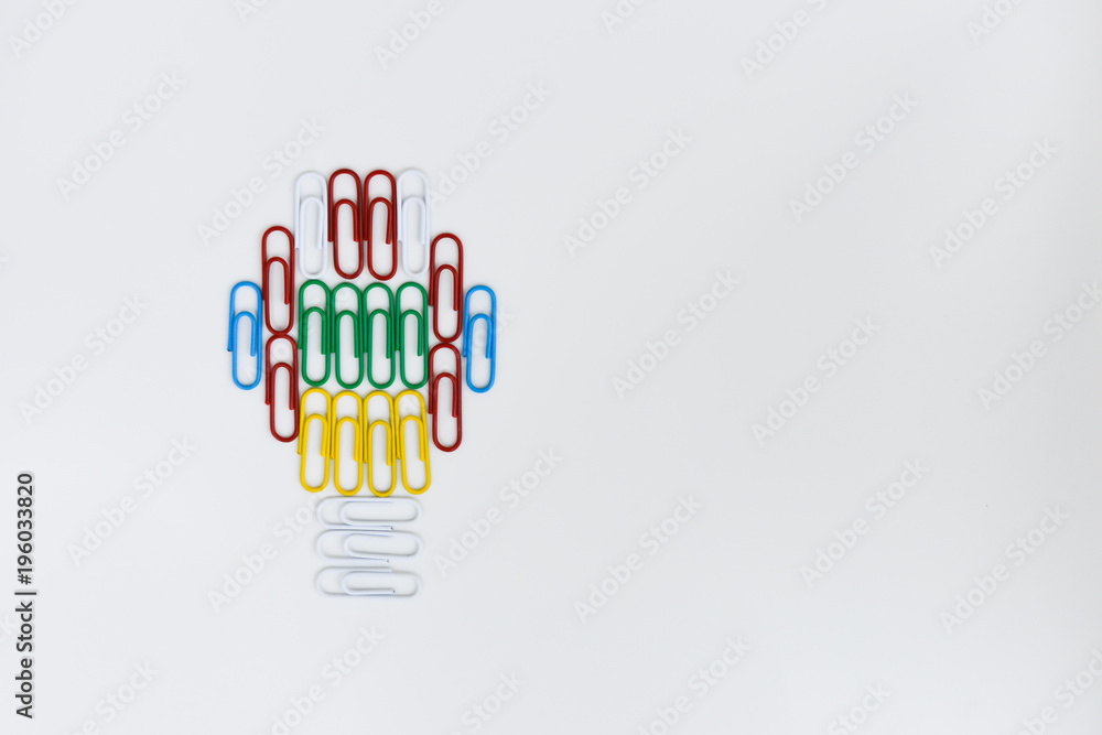 Colorful paper clip put on the white screen as the light bulb for idea ...