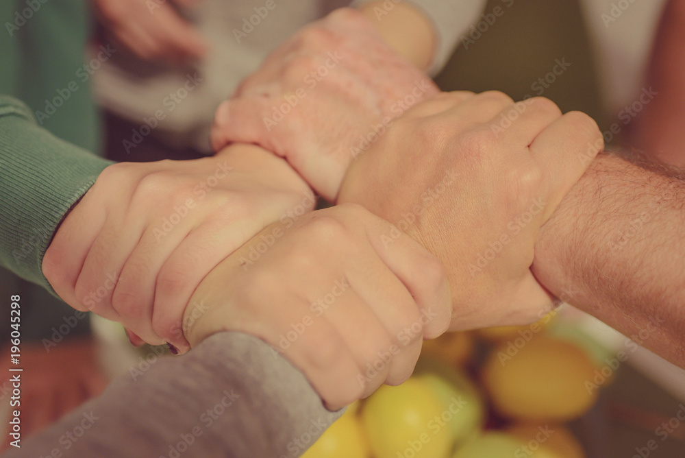 Family holding hands - a symbol of togetherness, unity, teamwork and ...