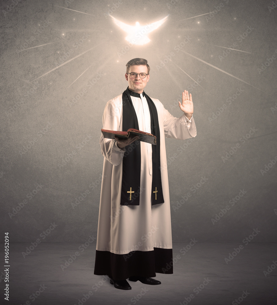 young priest in giving his blessing Stock Photo | Adobe Stock