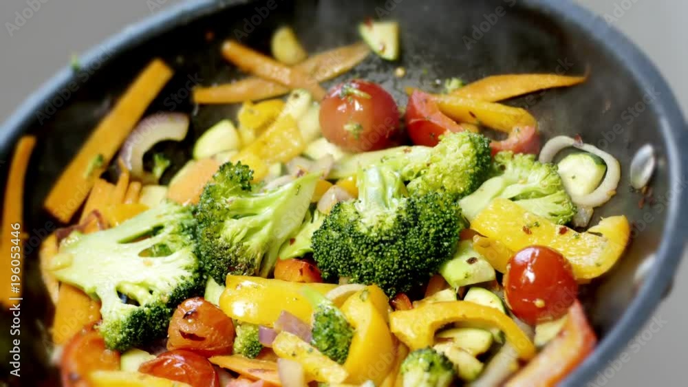 Cooking stir-fry vegetables a la flambe, chef frying vegs in a wok. 4K ...