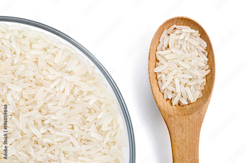 Healthy food. Close up of parboiled rice in glass bowl and wooden spoon ...