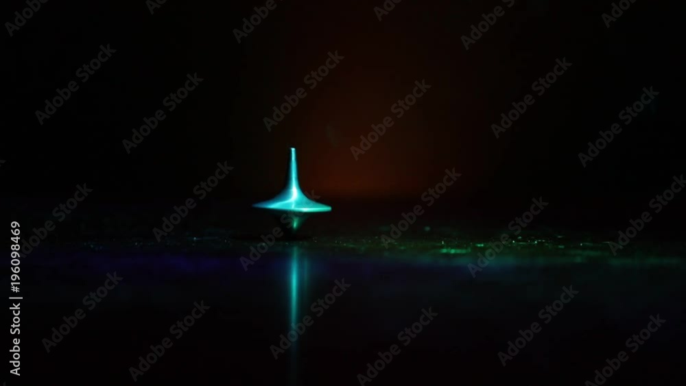 Totem spinning top spinning, wobbling and stopping. Spinning top on ...
