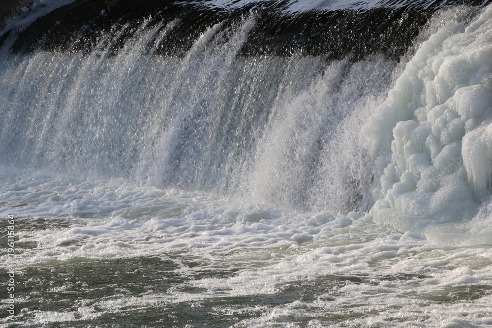 dam, waterfall. the stream of the river falls from the dam in the ...