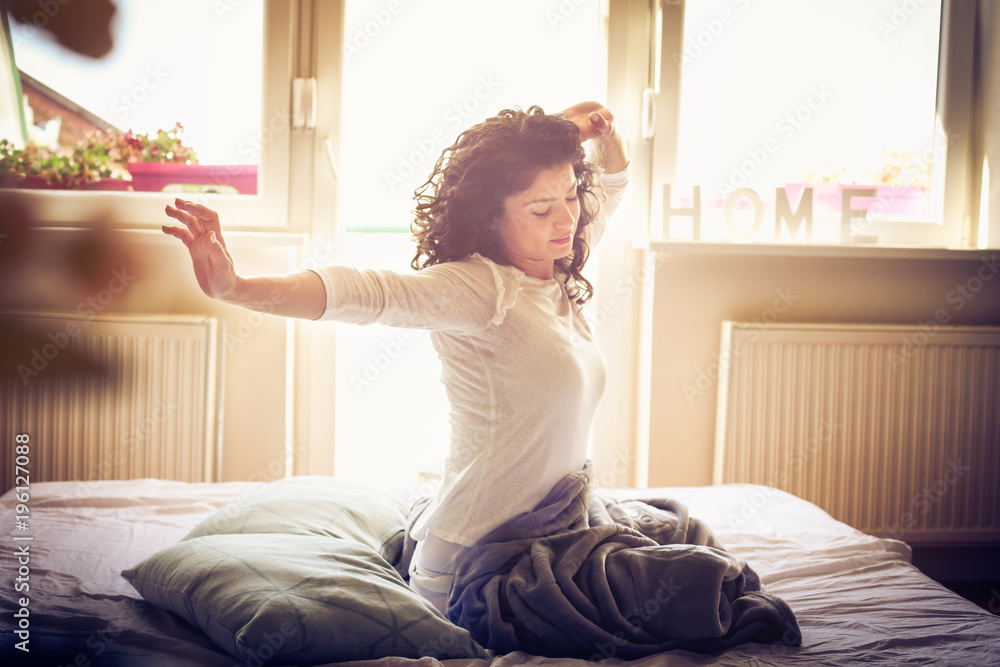 Stretching in bed. Stock Photo | Adobe Stock