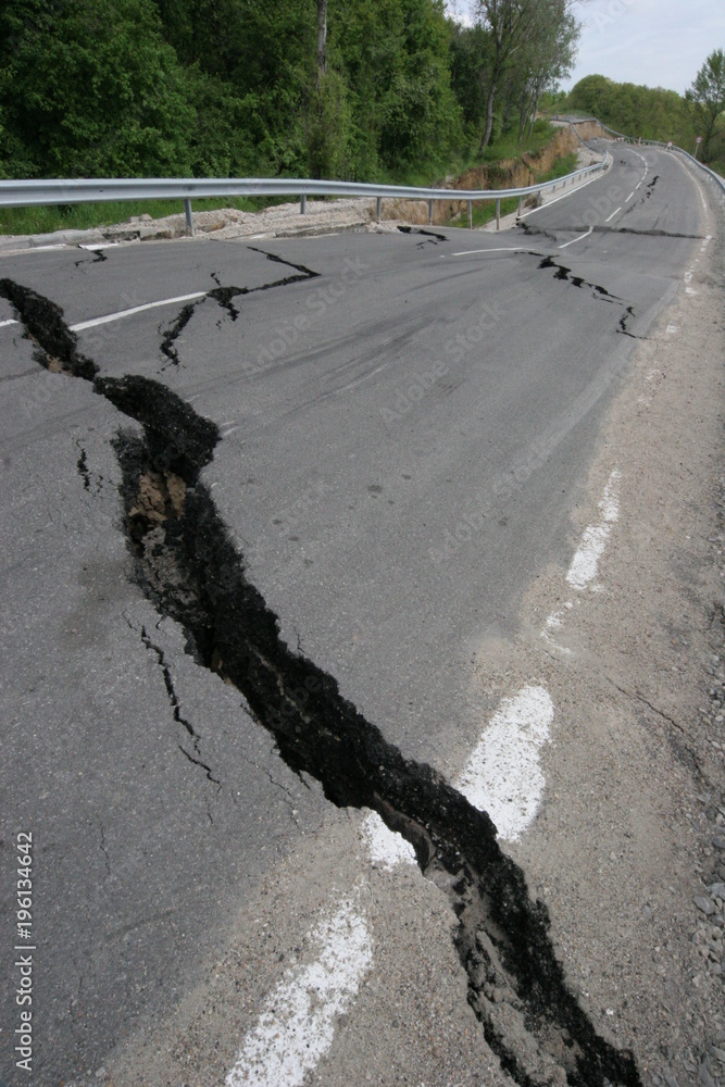 Road collapses with huge cracks. International road collapsed down ...