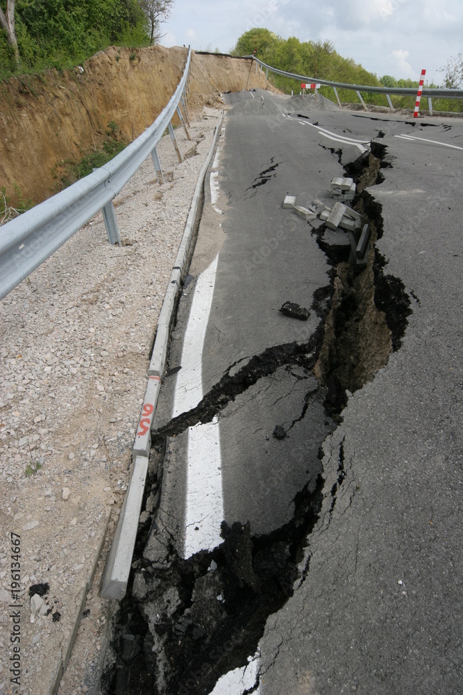 Road collapses with huge cracks. International road collapsed down ...