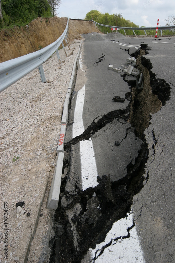 Road collapses with huge cracks. International road collapsed down ...