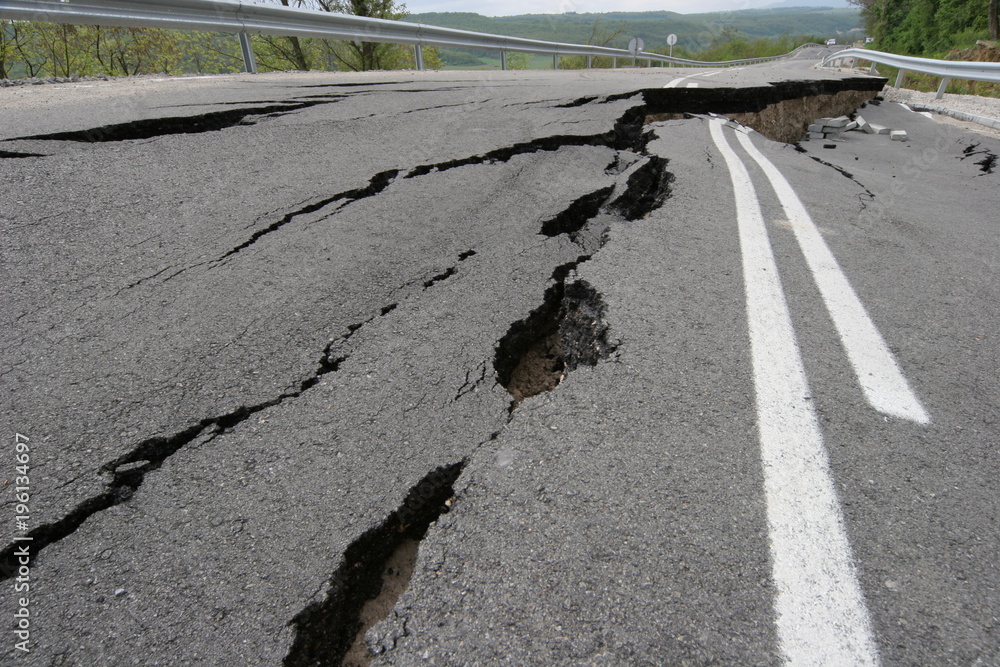 Road collapses with huge cracks. International road collapsed down ...