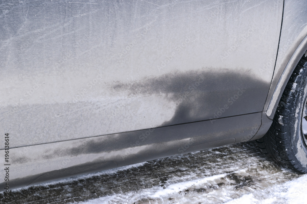 Side view of a very dirty car. Fragment of a dirty SUV. Dirty doors ...