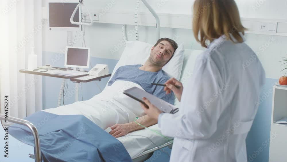 Professional Female Doctor Visits Male Patient who is Lying in Bed, She ...