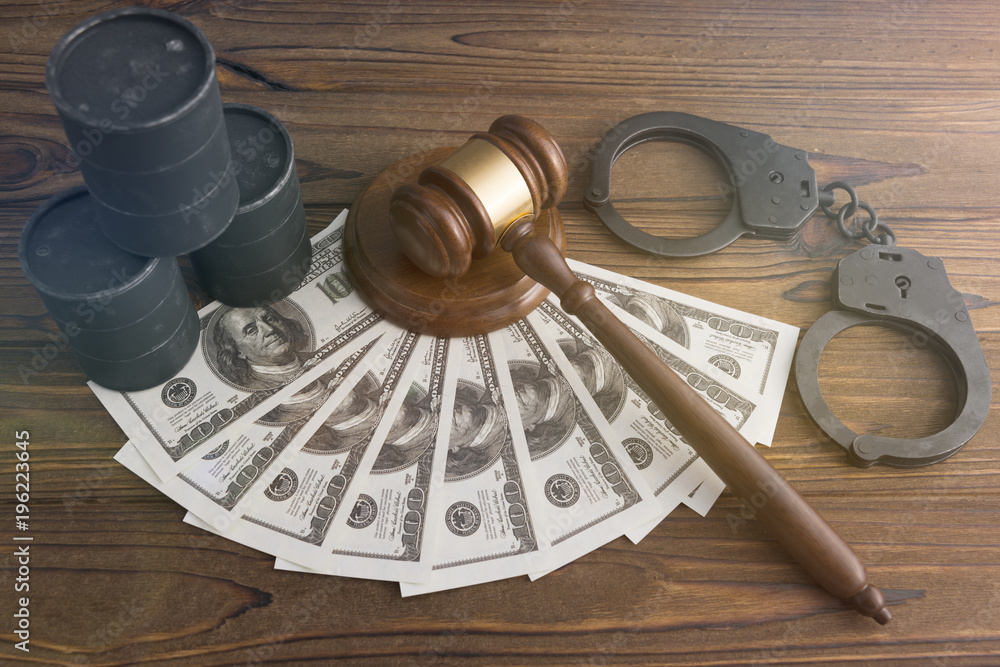 barrels with oil dollars handcuffs judge's hammer. handjobs. concept of ...