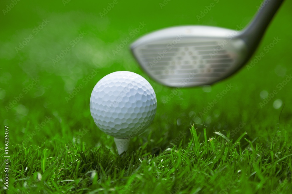 Golf Ball On Tee With Club